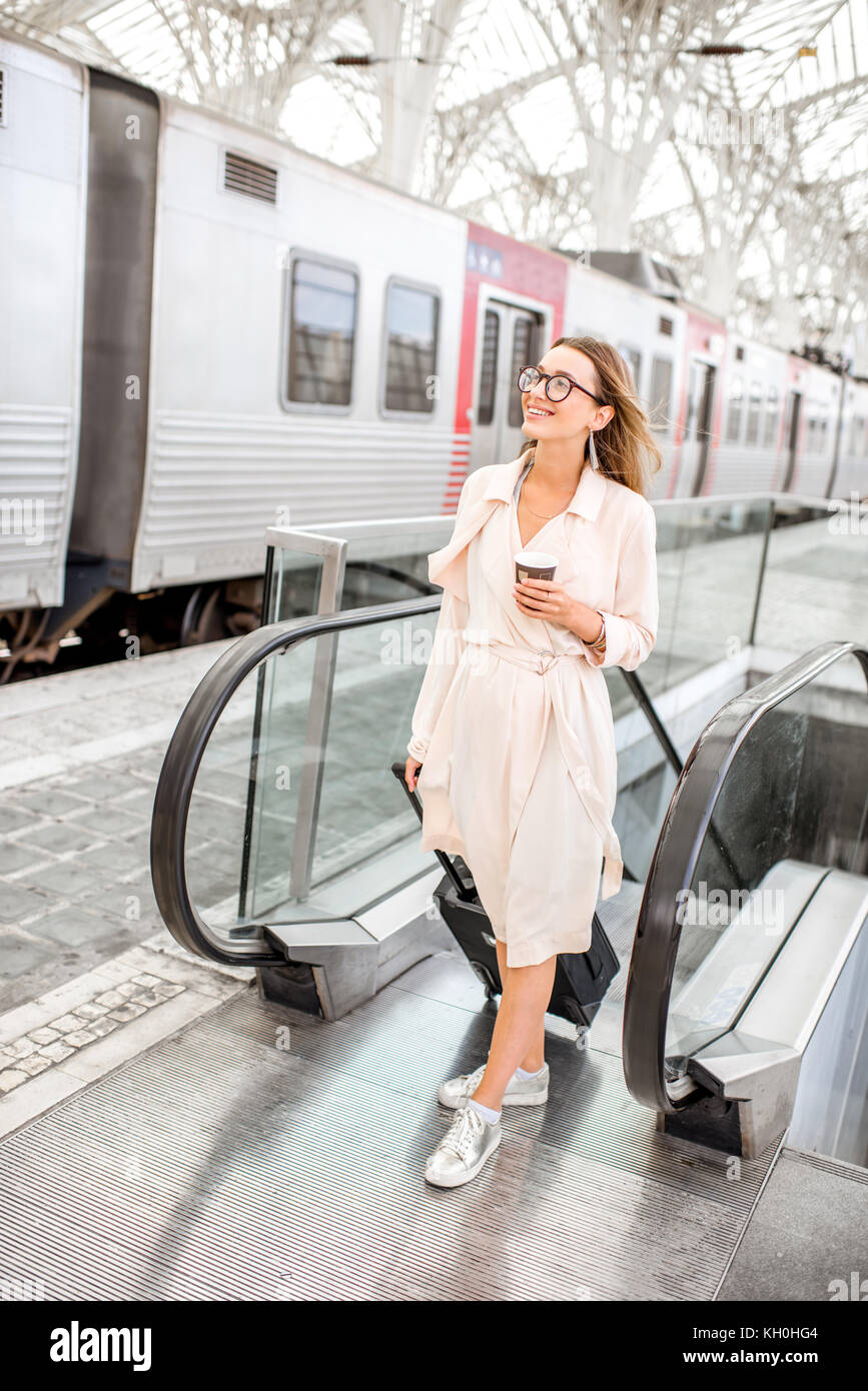 Woman at the railway station Stock Photo - Alamy