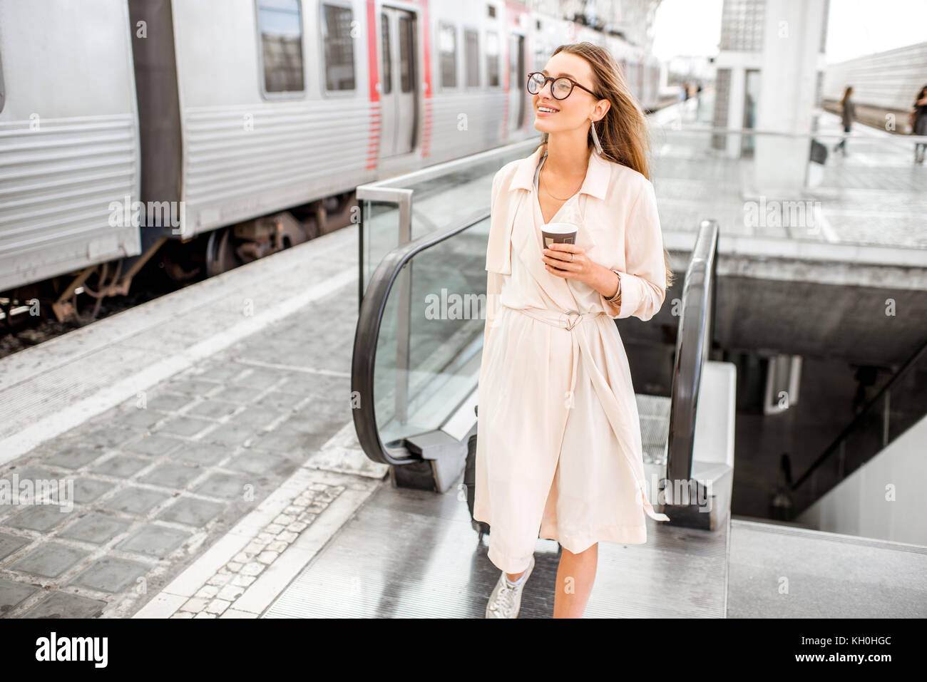 Woman at the railway station Stock Photo - Alamy