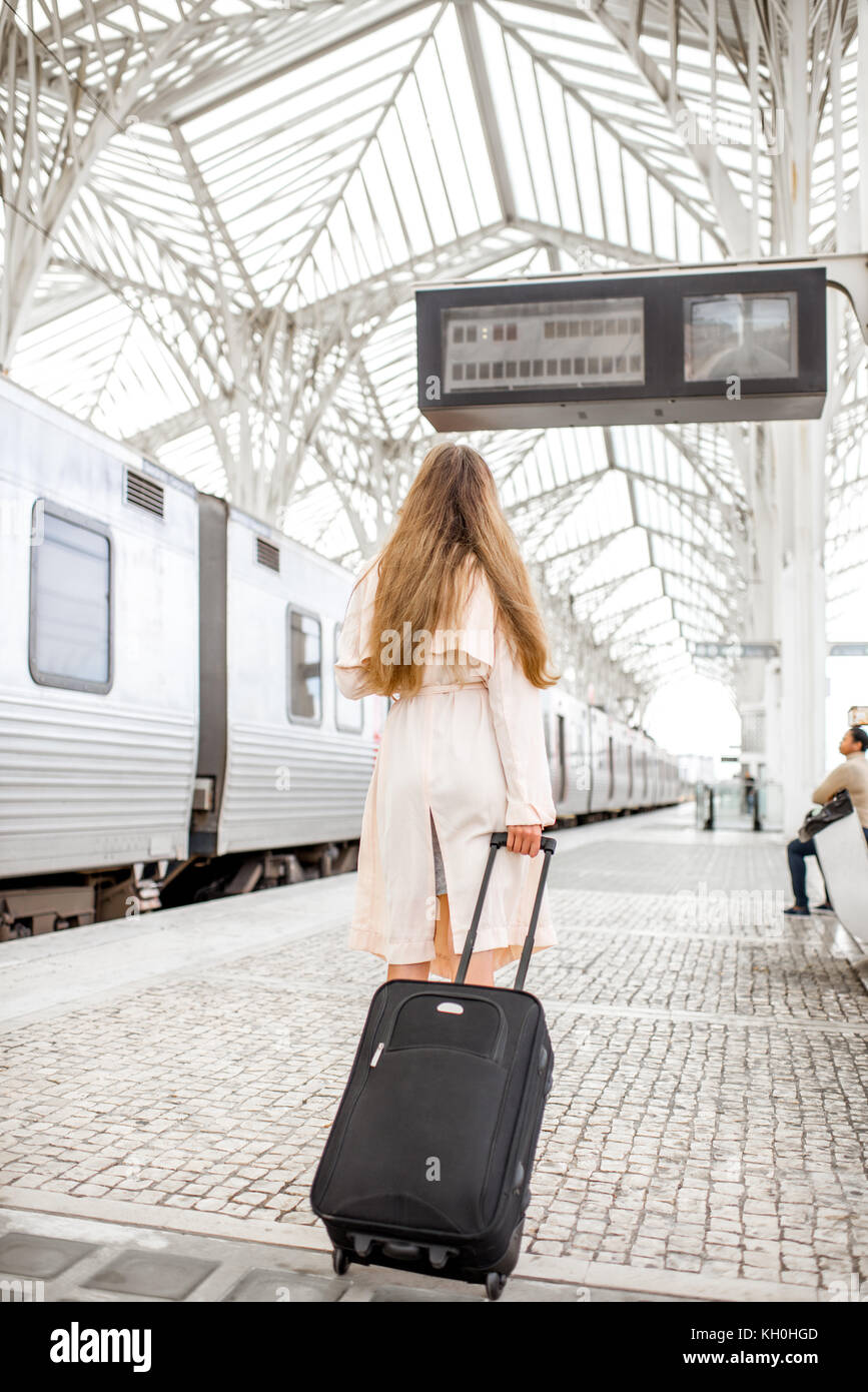 Woman at the railway station Stock Photo - Alamy