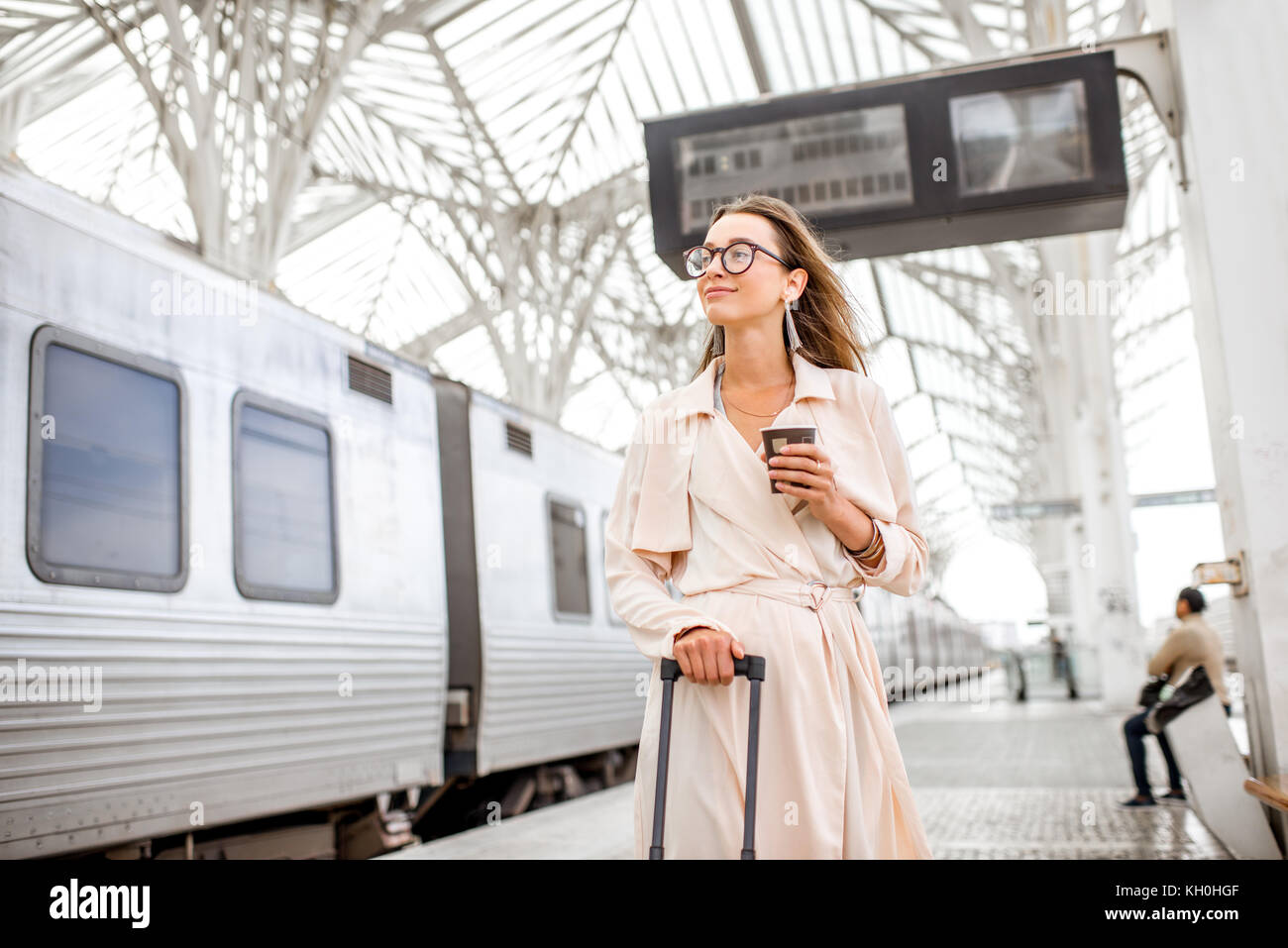 Woman at the railway station Stock Photo - Alamy