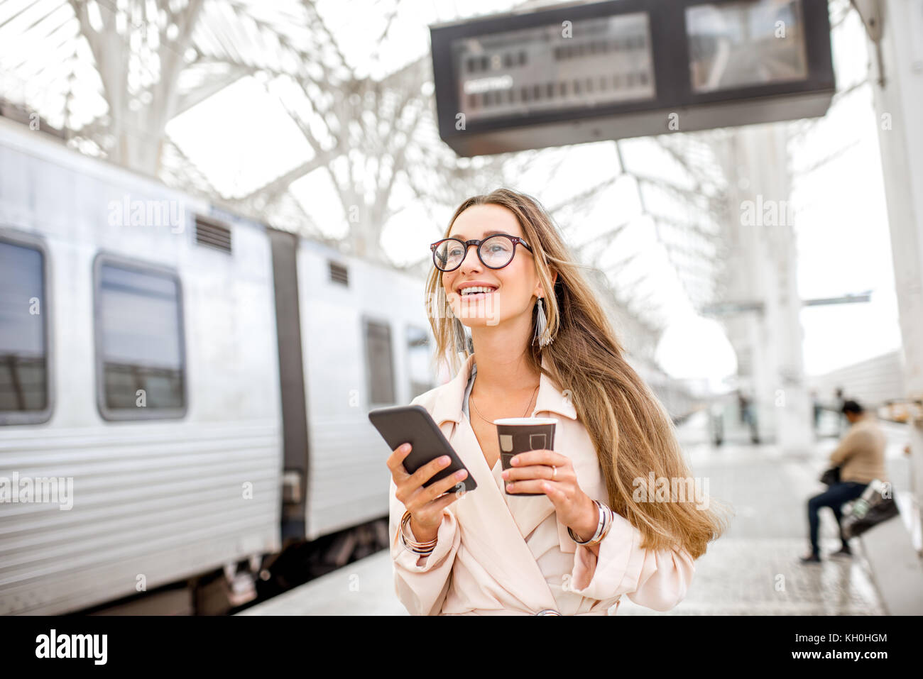Woman at the railway station Stock Photo - Alamy