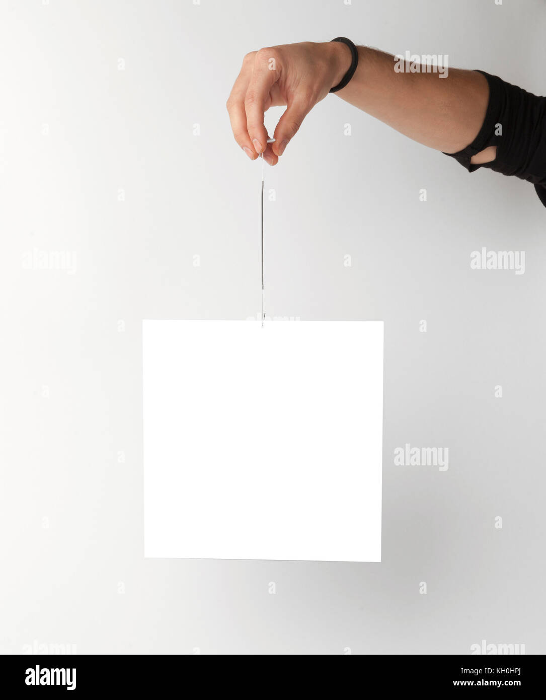 hand holding a white banner Stock Photo - Alamy