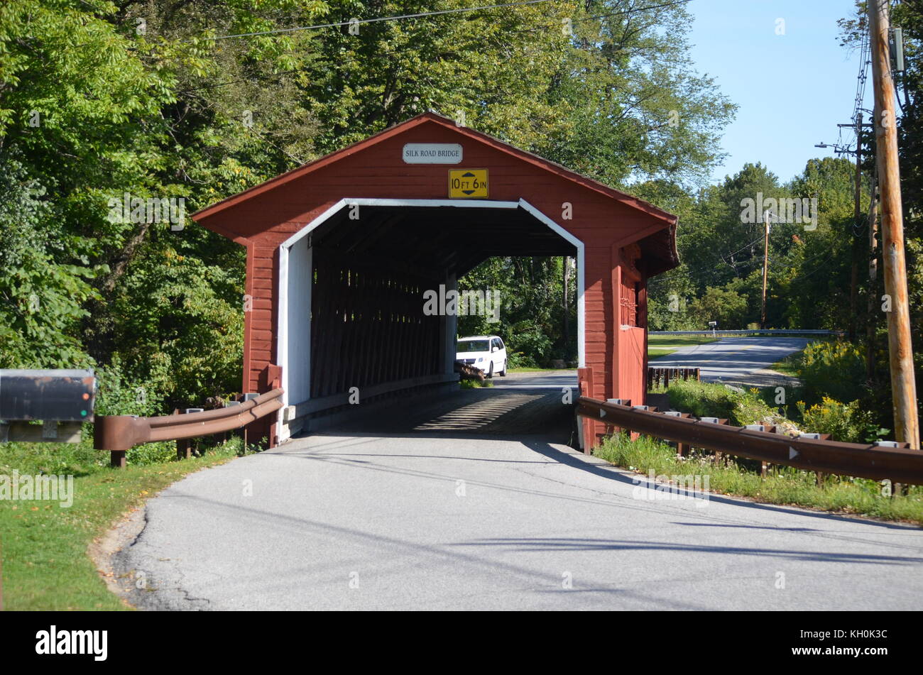 A red covered bridge in Vermont Stock Photo - Alamy