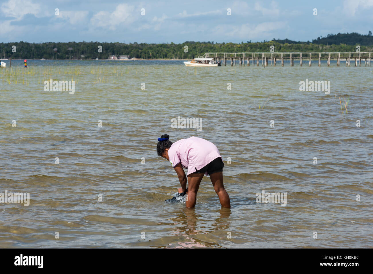 A Malagasy woman washing clothes in a lake. Madagascar, Africa Stock ...