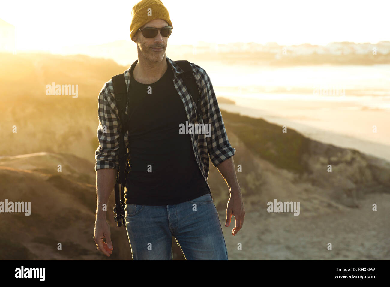 Man in outdoor with the beach on background Stock Photo - Alamy