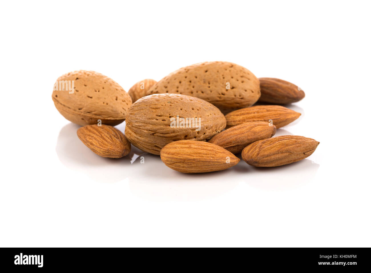 Pile of almonds nuts on a white background Stock Photo - Alamy