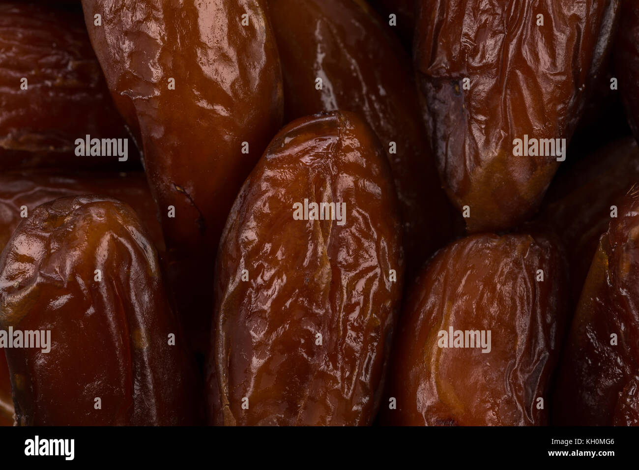 pile of dates fruits close up for background Stock Photo - Alamy
