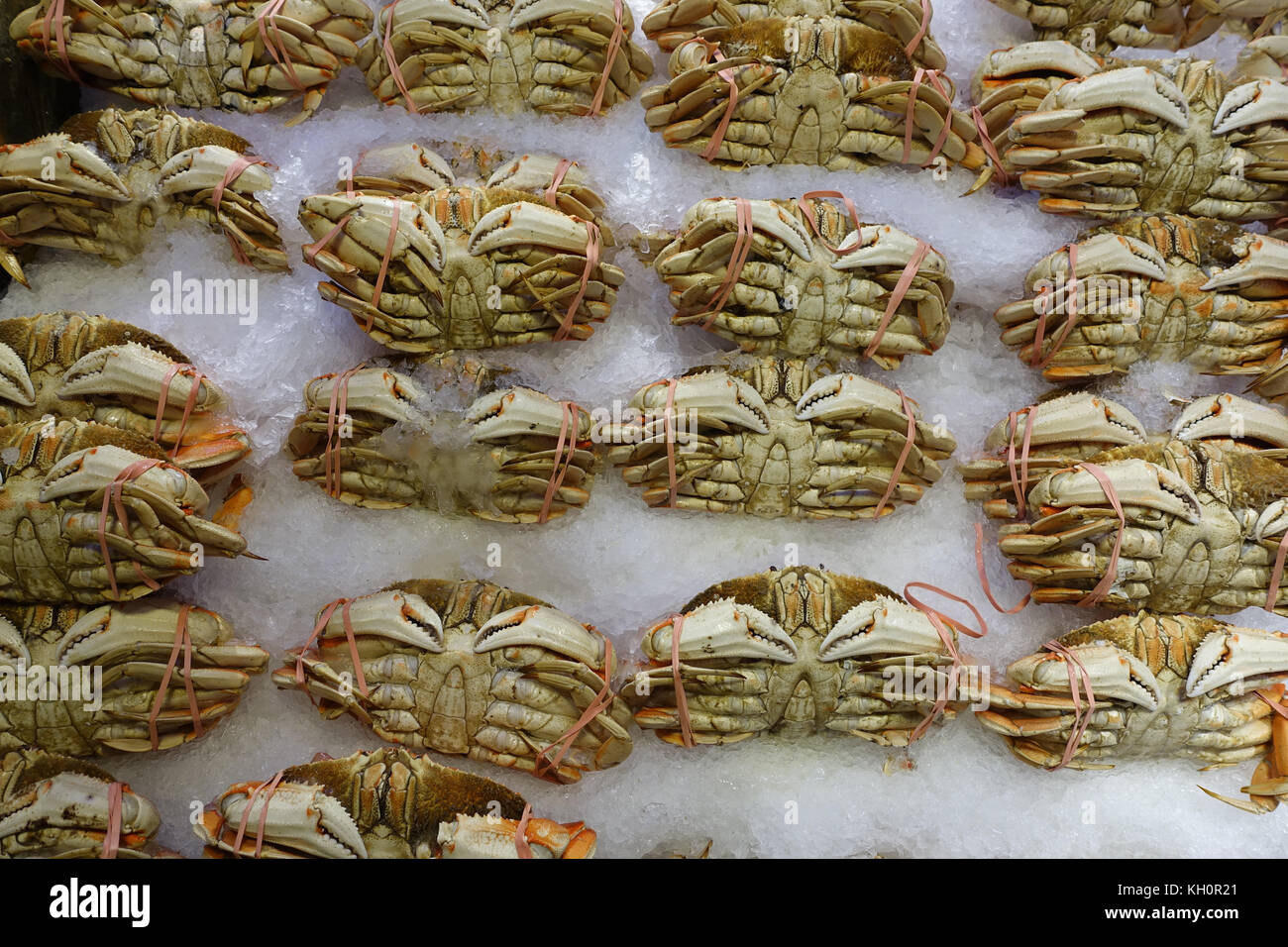 A fish stand sells Dungeness crabs at the Pike Place Market in Seattle ...