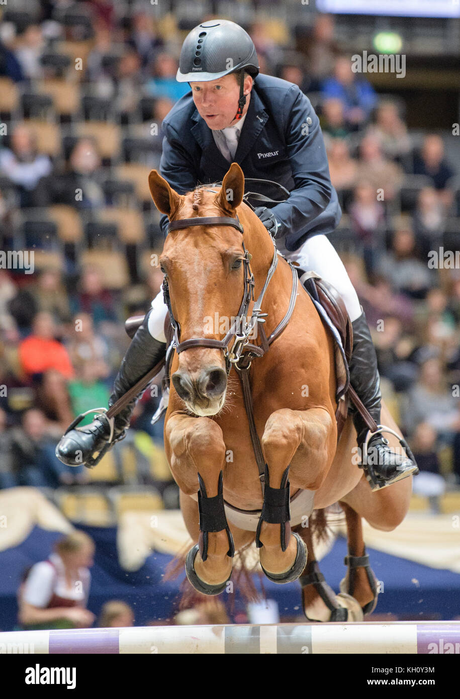 Munich, Germany. 12th Nov, 2017. The German rider Markus Beerbaum jumps ...