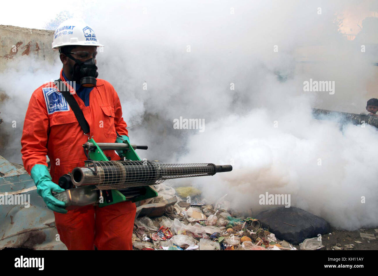Workers spraying fumigation during Anti Dengue Mosquito Fumigation ...