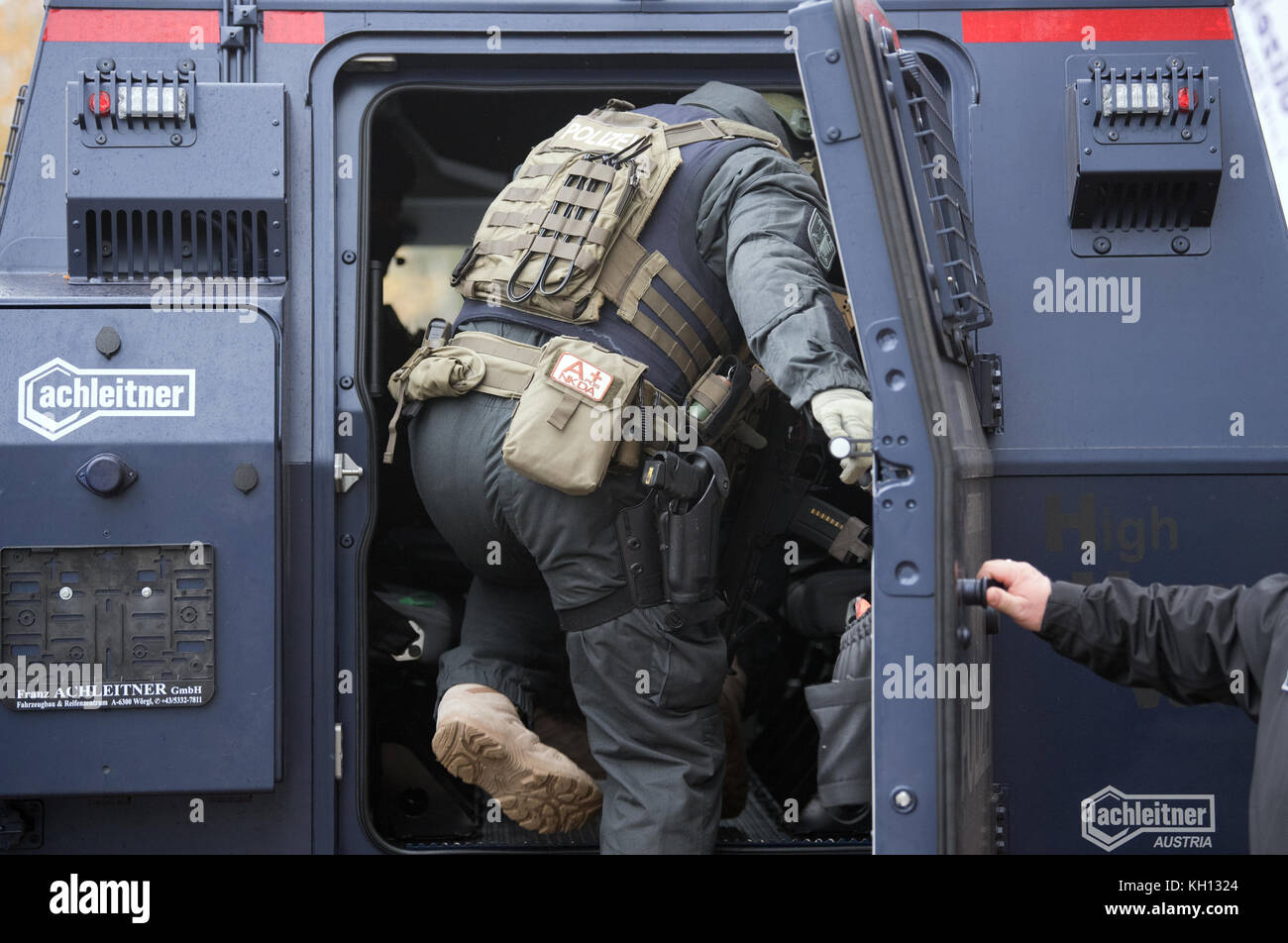 SWAT team officers boarding a new, armoured special protection vehicle ...