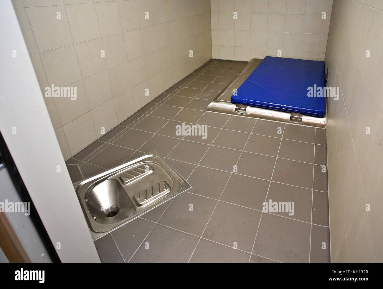 A holding cell pictured in the police station in Dusseldorf, Germany ...