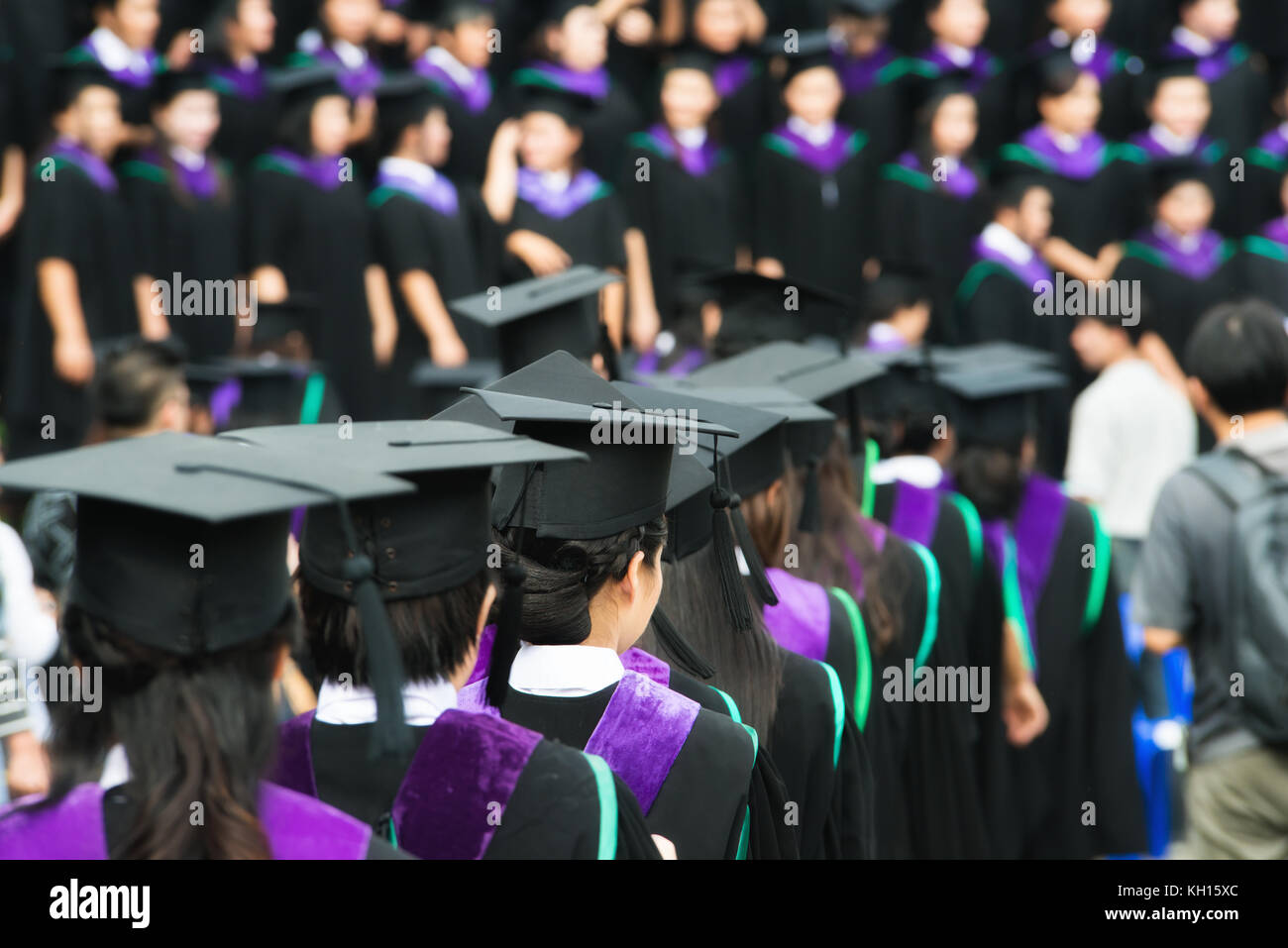 Back of graduates during commencement at university. Close up at ...