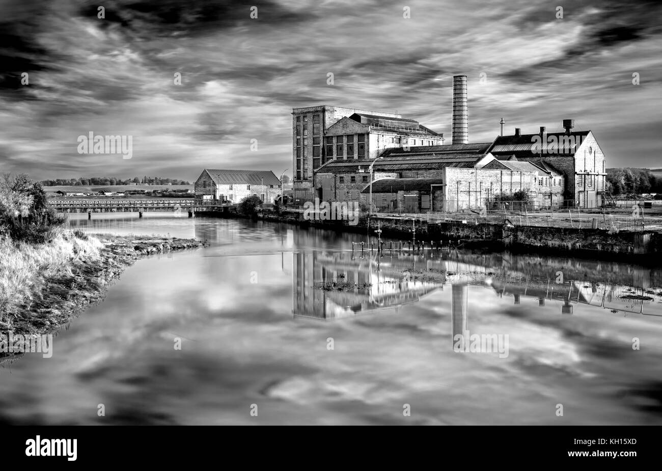 Old Factory Building reflects in the Water Stock Photo - Alamy