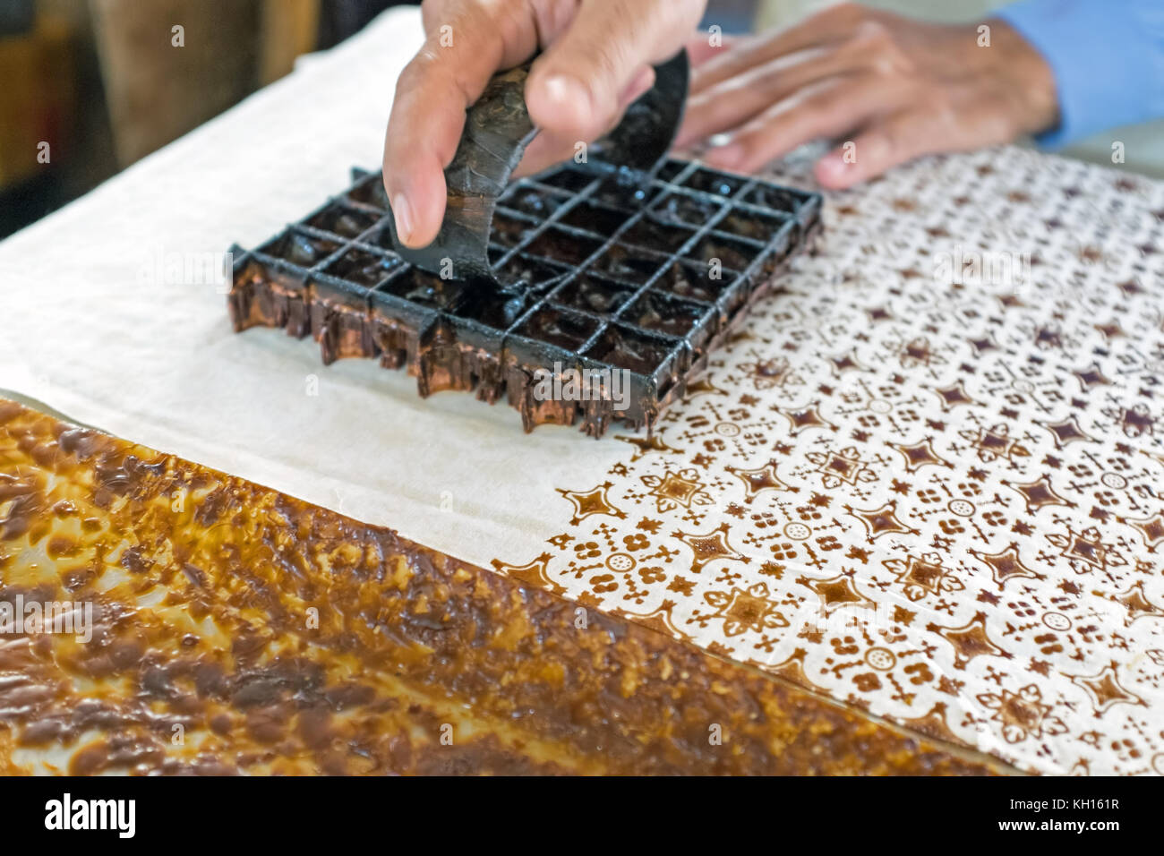 Printing on the fabric to make batik. Batik is part of the indonesian ...