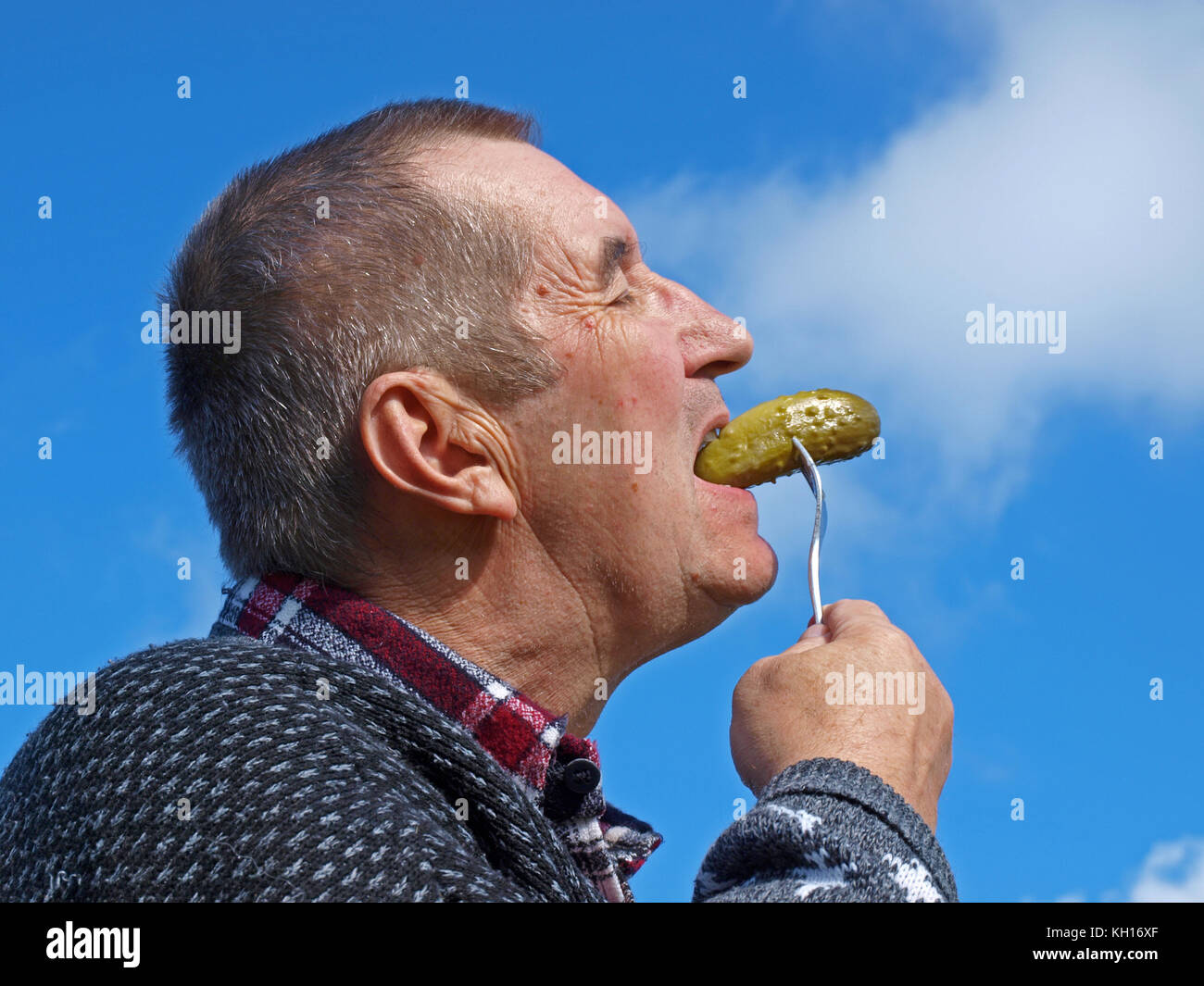 Man Eating A Pickle