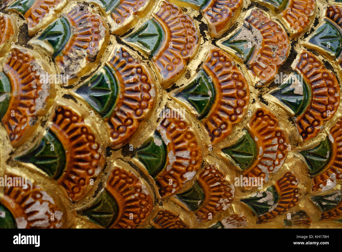 Decorative and ethnic pattern in the form of a serpent scales of green ...