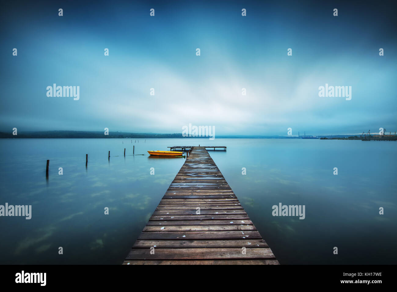 Small Dock and Boat at the lake Stock Photo - Alamy