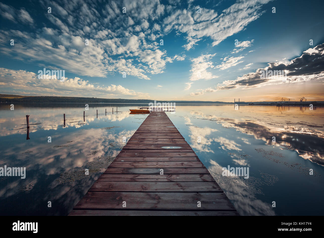 Small Dock and Boat at the lake Stock Photo - Alamy