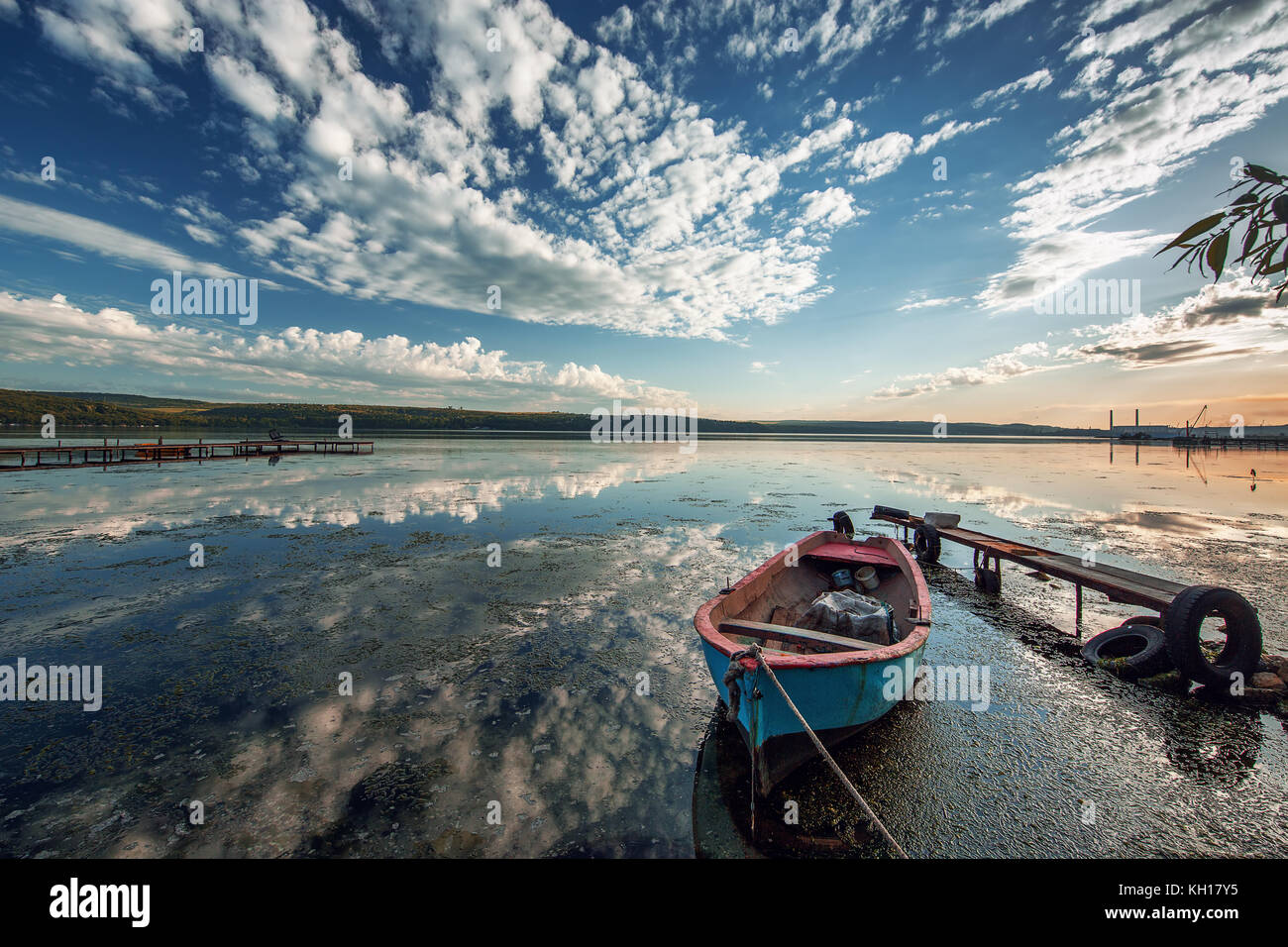 Small Dock and Boat at the lake Stock Photo - Alamy