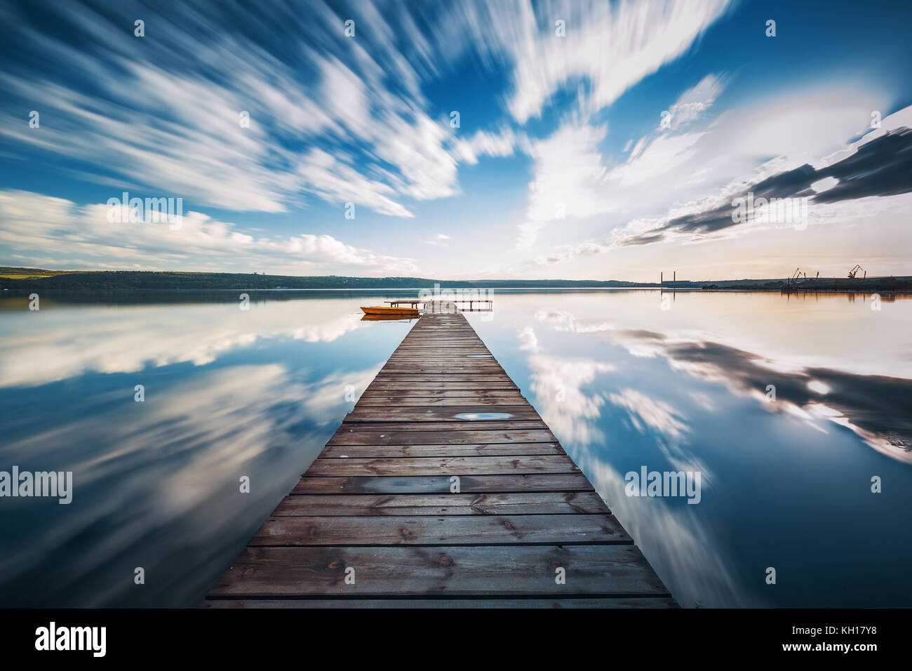 Small Dock and Boat at the lake Stock Photo - Alamy