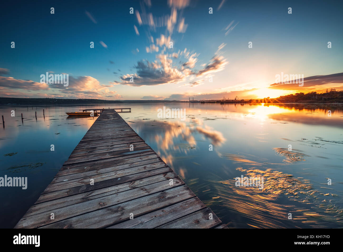 Small Dock and Boat at the lake Stock Photo - Alamy