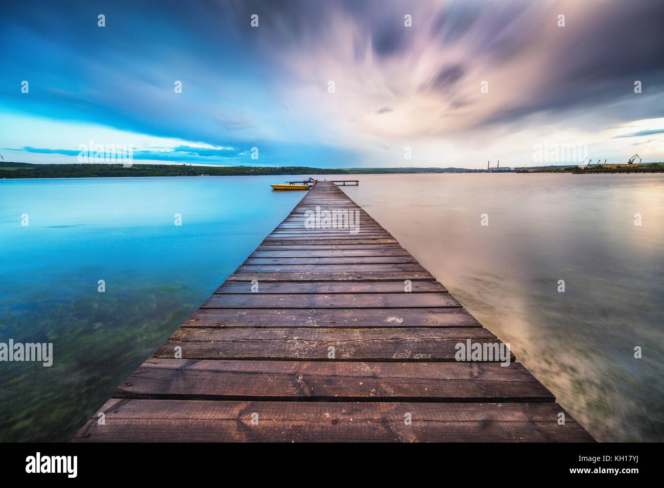 Small Dock and Boat at the lake Stock Photo - Alamy