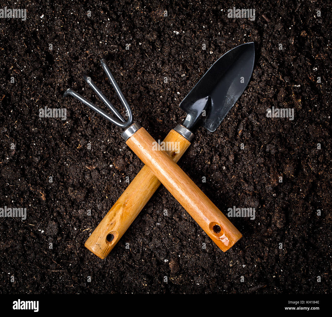 Gardening tools on plain soil. Image taken from above, top view Stock ...