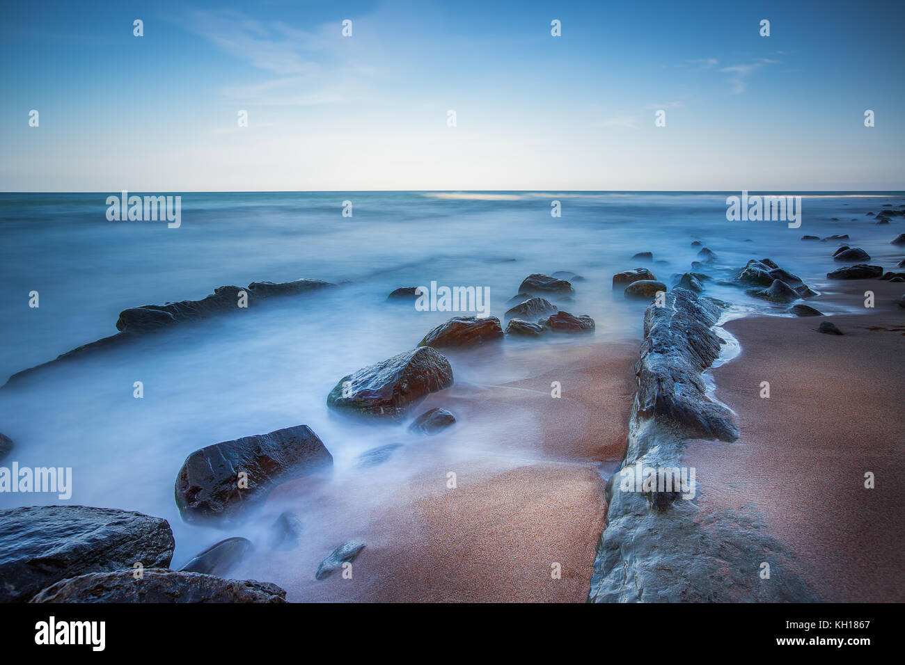 Long exposure of sea and rocks Stock Photo - Alamy