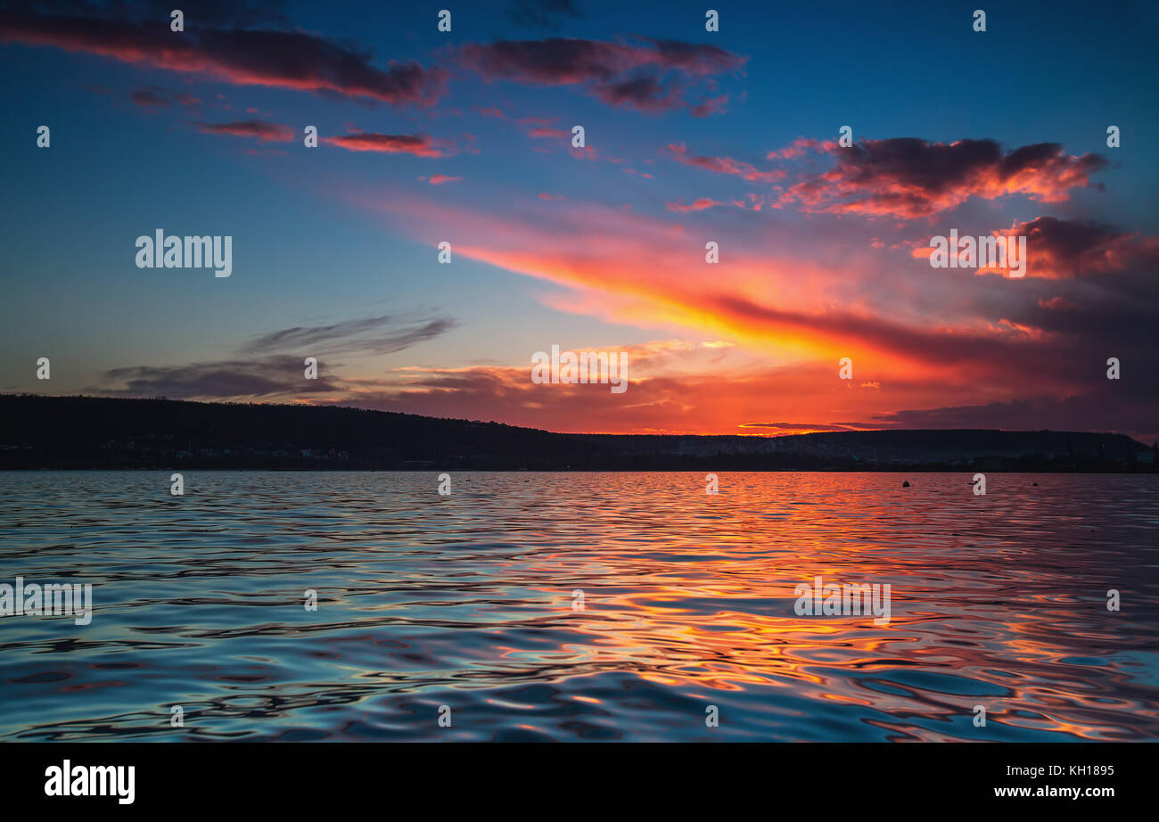Beautiful cloudscape over the lake, sunset shot Stock Photo - Alamy