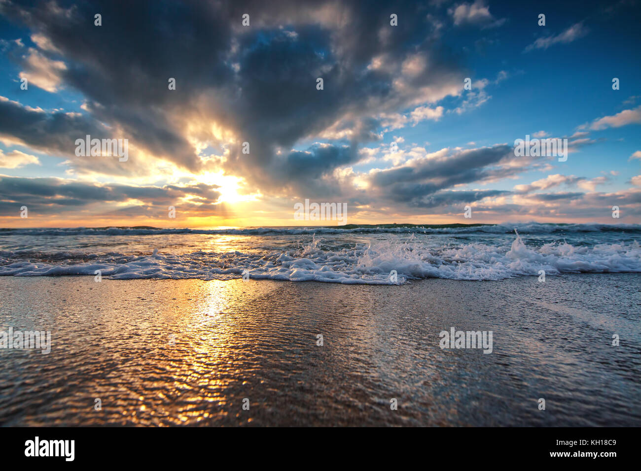 Sea wave close up, low angle view, sunrsie shot Stock Photo - Alamy
