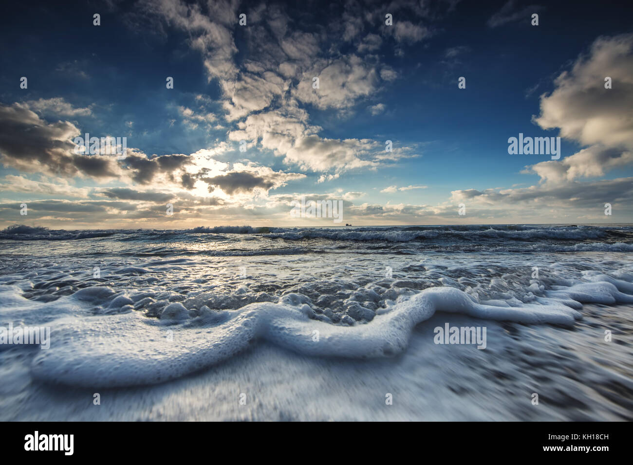 Sea wave close up, low angle view, sunrsie shot Stock Photo - Alamy