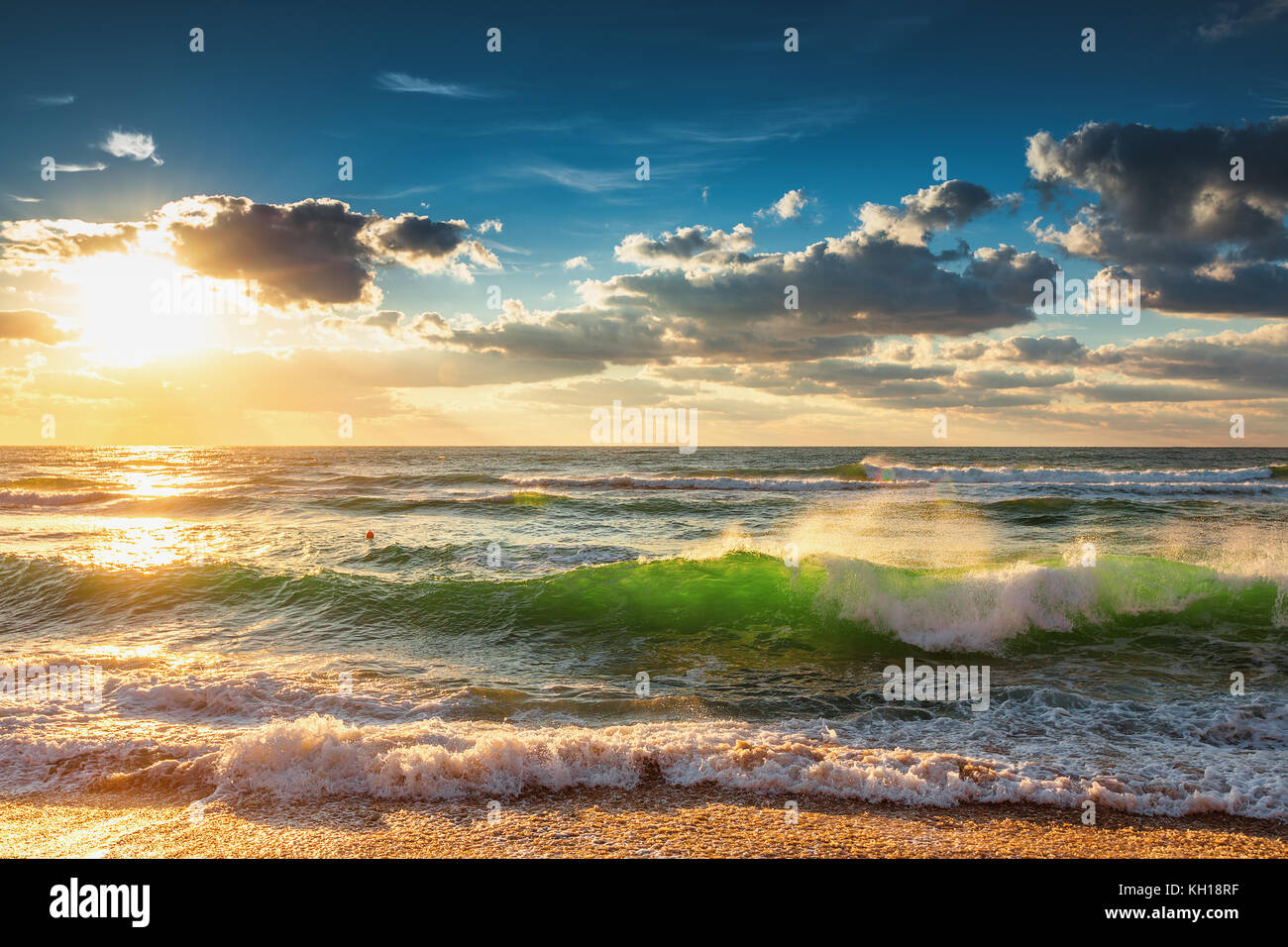 Beautiful green sunrise wave Stock Photo - Alamy