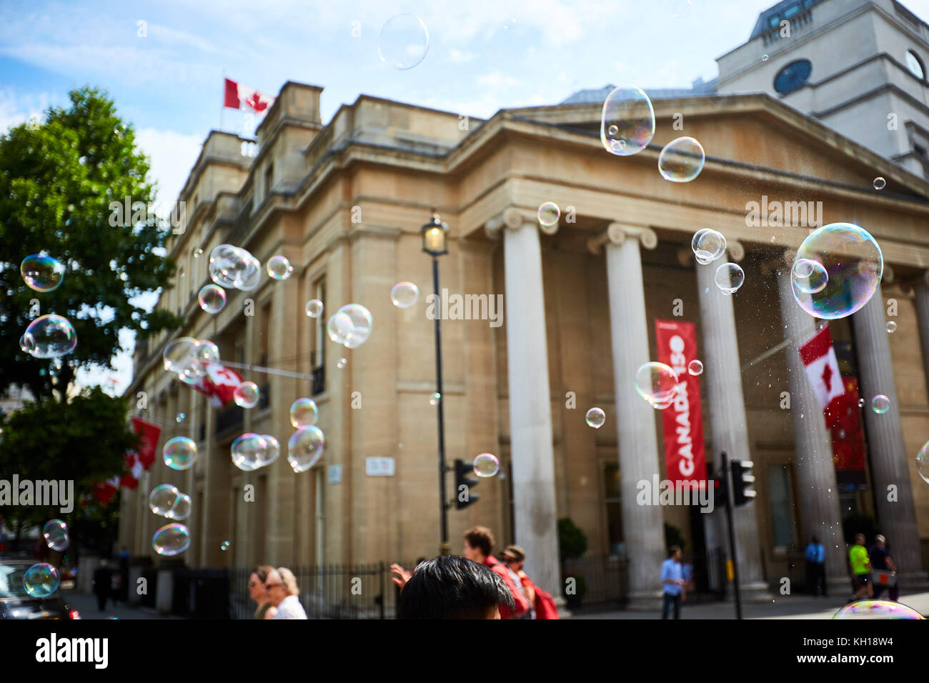 Bubbles in front of Canada House on Trafalgar Square Stock Photo - Alamy
