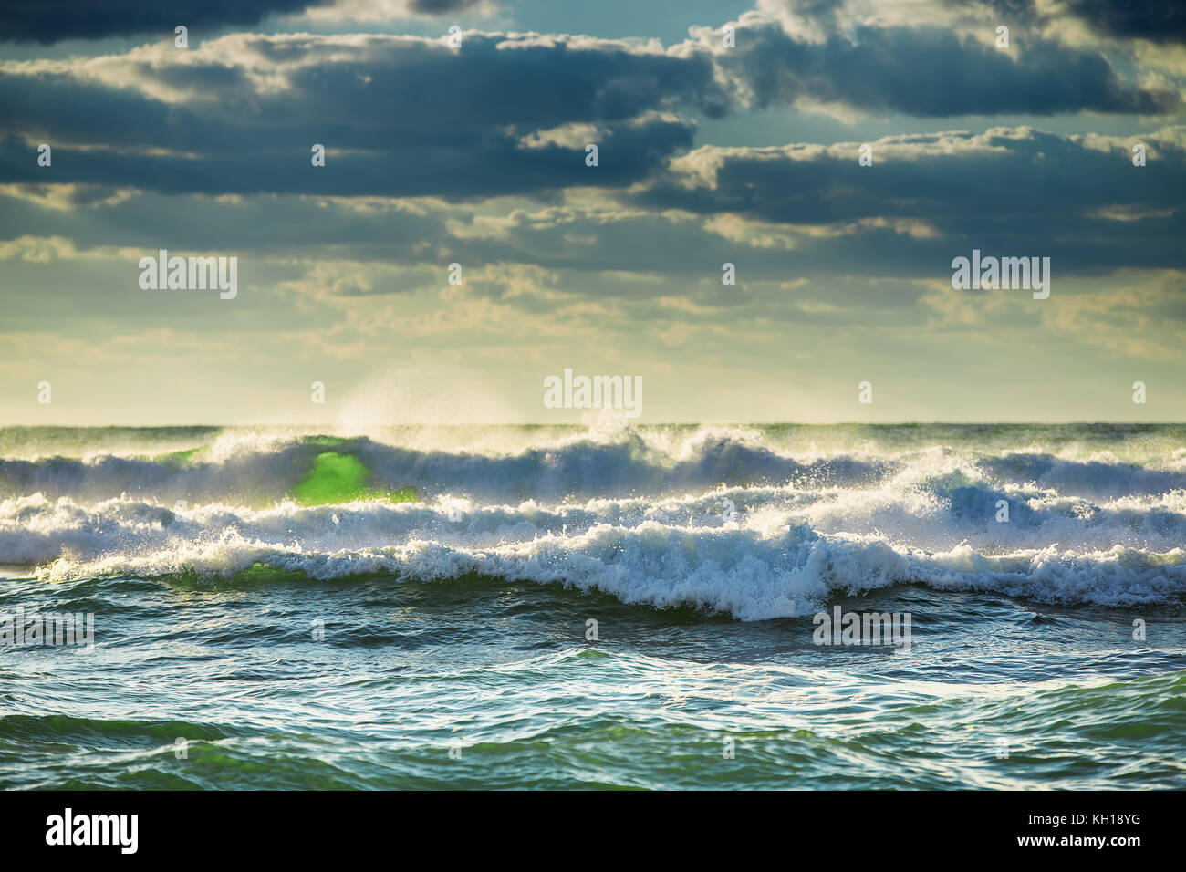 Beautiful green sunrise wave Stock Photo - Alamy