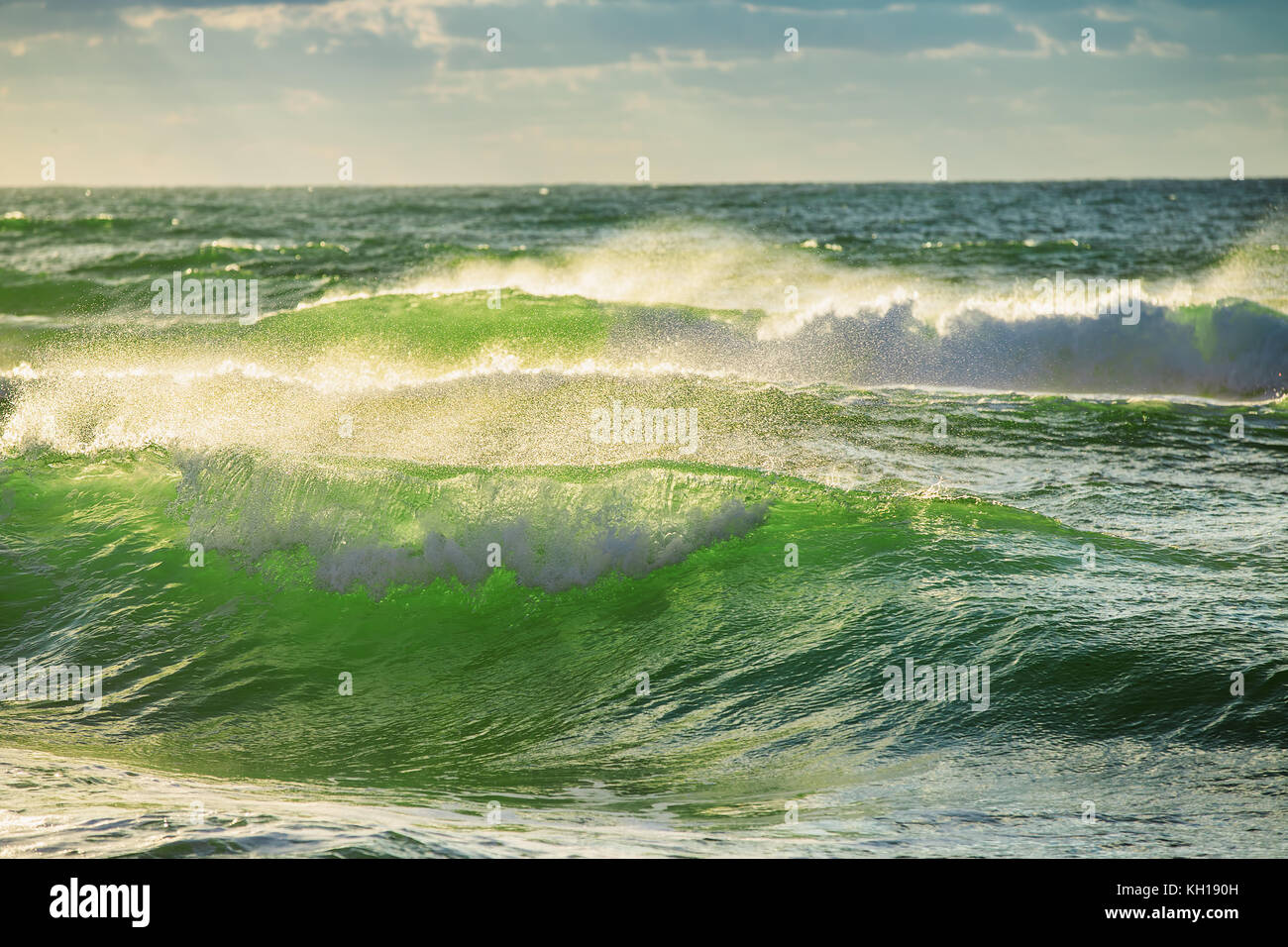 Sunrise clouds sky weather sun waves water surf hi-res stock ...