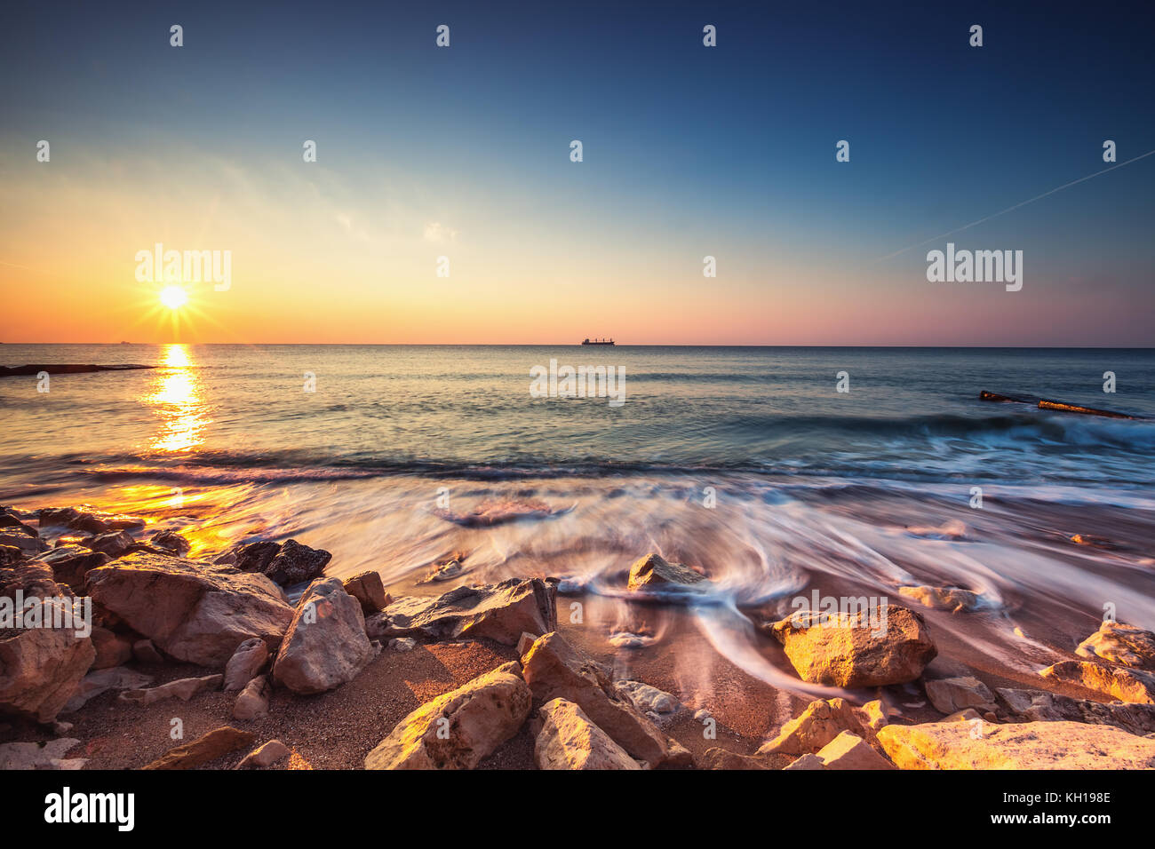Golden sea sunrise washing waves hi-res stock photography and images ...