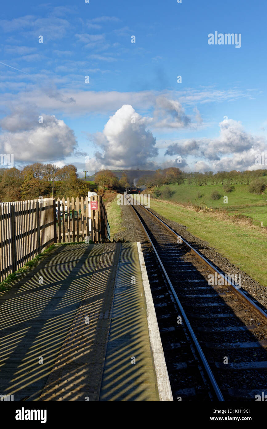 Burrs country park railway station platform with long shadows, with ...