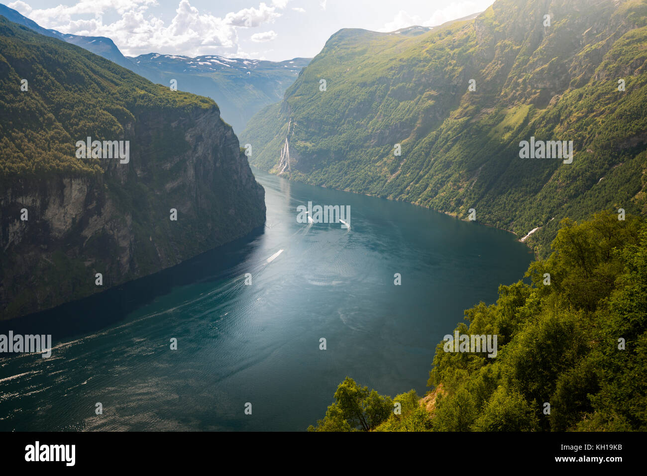 Ships in waters of fiord, Norway, Scandinavia, Europe. Blue cloudy sky ...