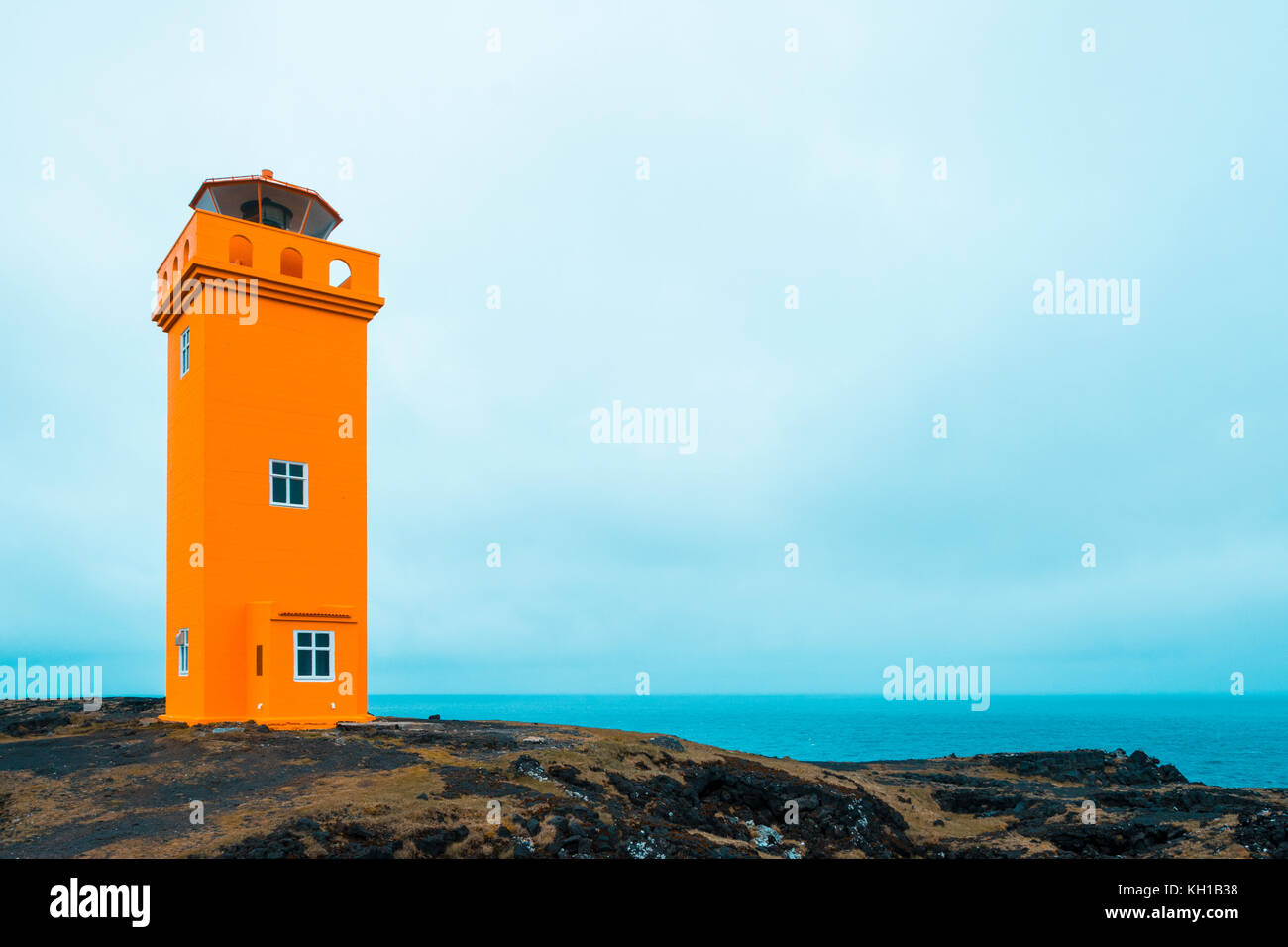 Teal and orange color Saxholsbjarg lighthouse in Snaefellsnes peninsula ...