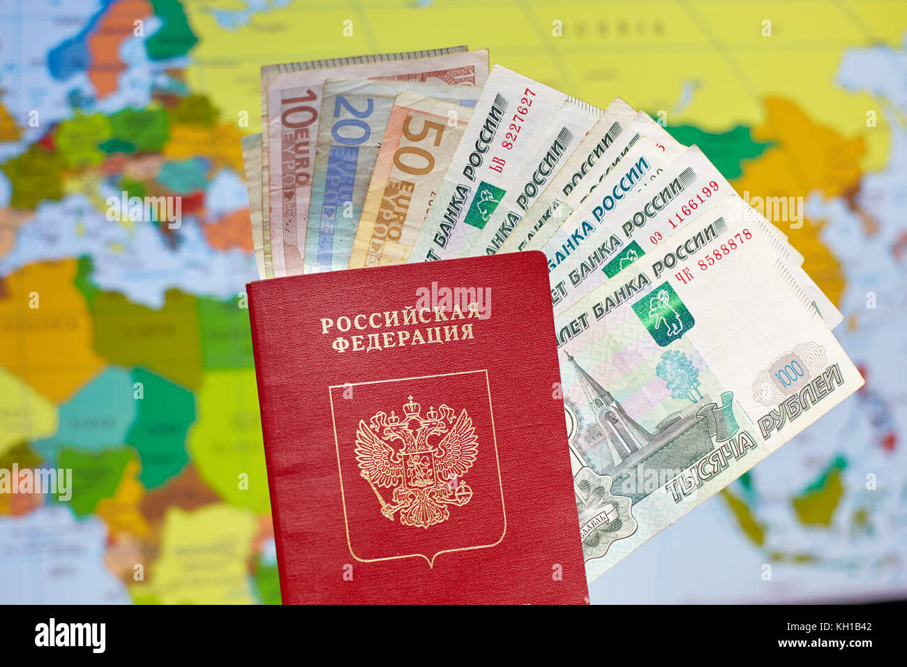 Russian passport with euro banknotes and rubles on the background of ...