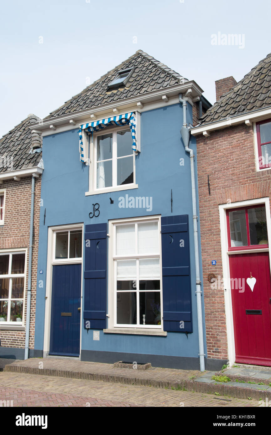 Street with old, blue renovated house Stock Photo - Alamy