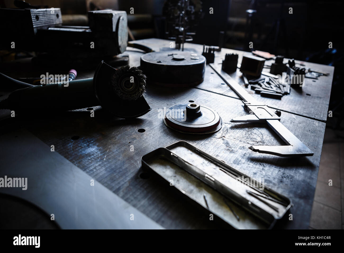 Welder workshop.Professional trammel ruler,electric grinder machine on ...