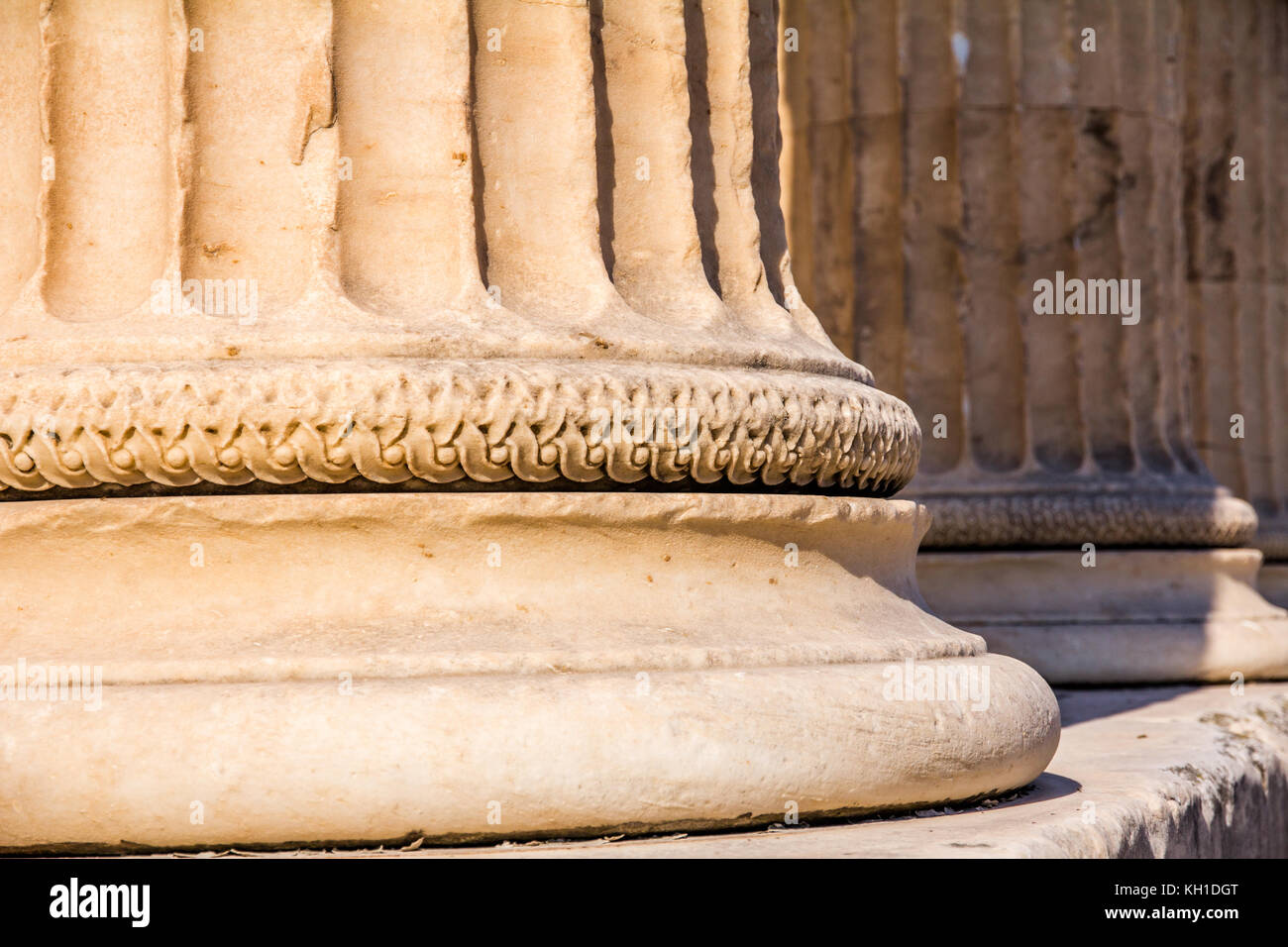 Close-up of the base of a massive marble column of the Erechtheion on ...