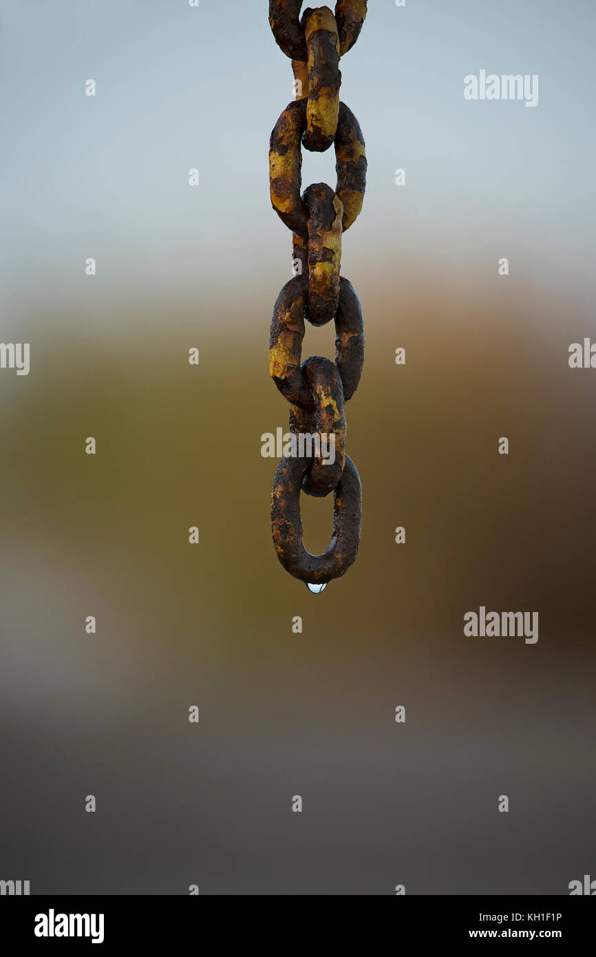 Drop at the end of a chain Stock Photo - Alamy