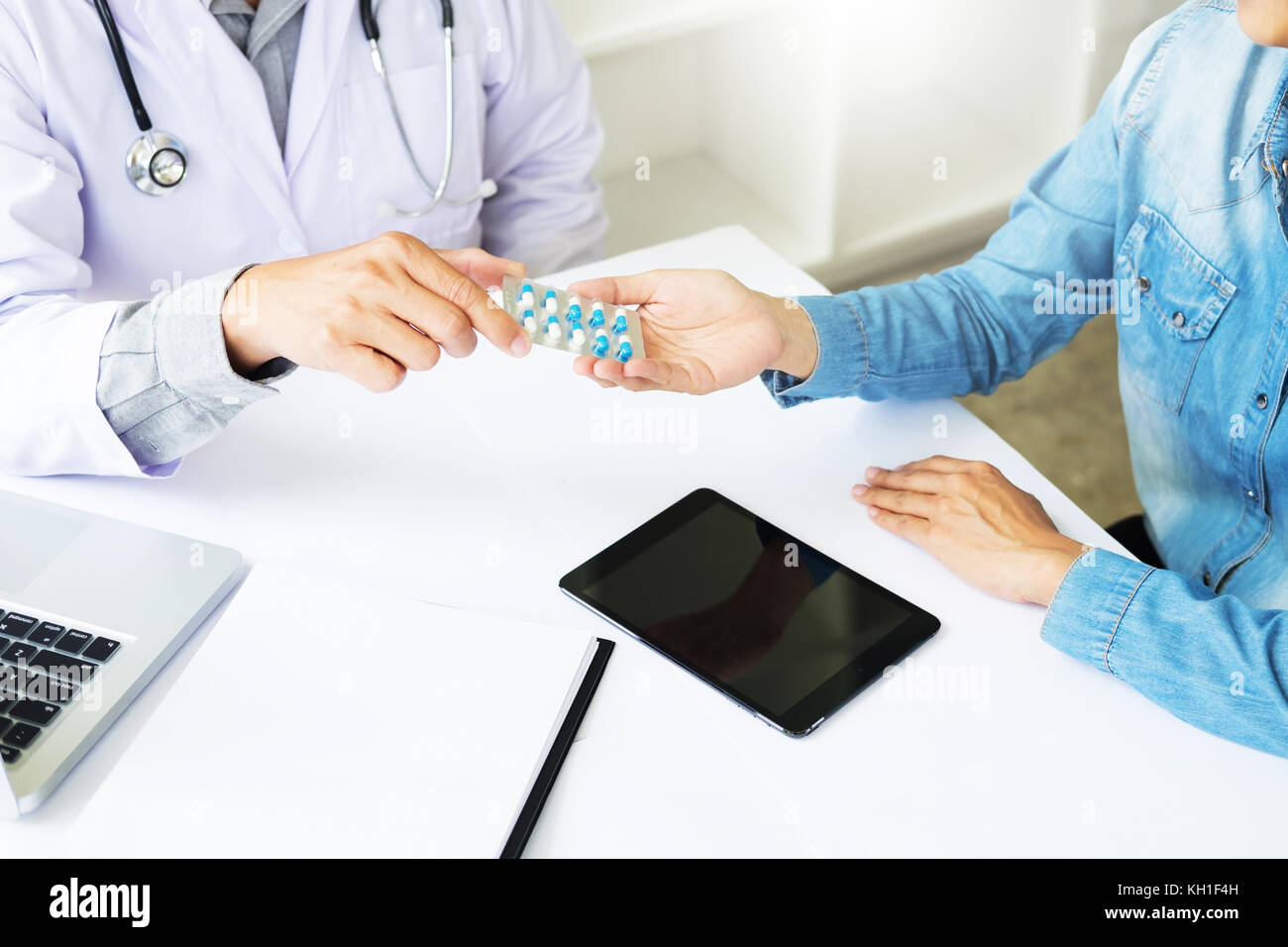 Female doctor hand holding tablet to patient in hospital room Stock ...