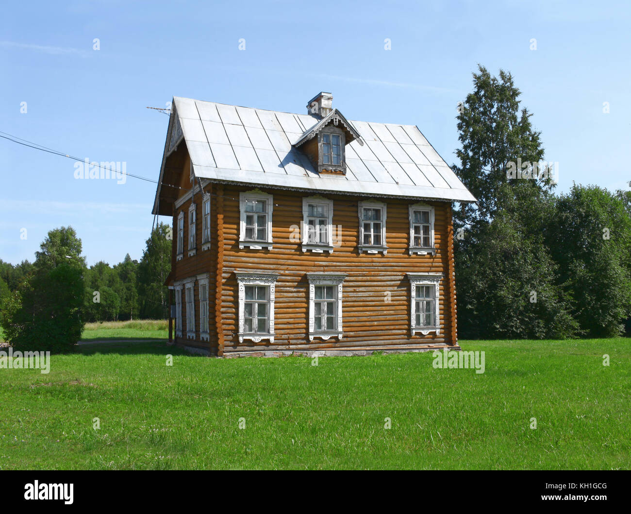 View of the old a log house with an attic Stock Photo - Alamy