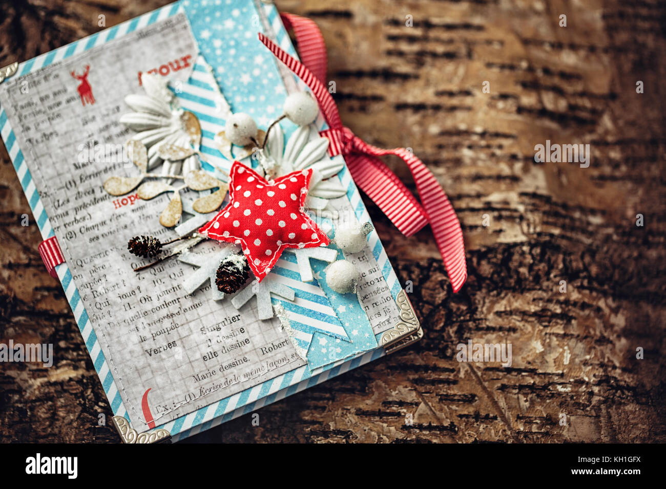Handmade photobook on a wooden texture Stock Photo - Alamy