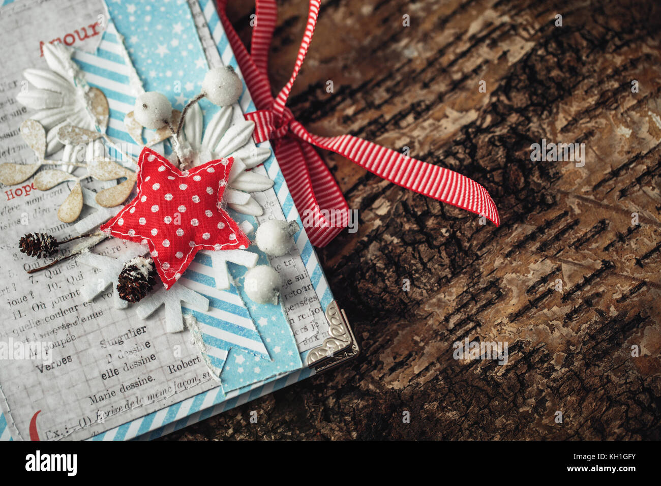 Handmade photobook on a wooden texture Stock Photo - Alamy