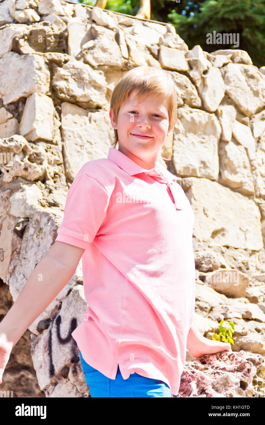 Boy in pink shirt hi-res stock photography and images - Alamy